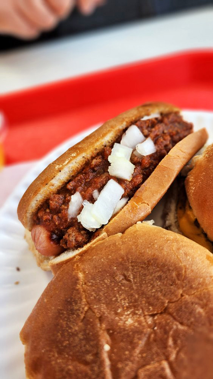 This isn't just any chili dog &ndash; it's a masterclass in comfort food engineering, where every bite delivers meaty, spicy perfection.