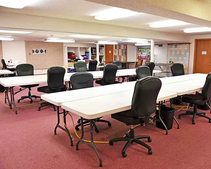 The classroom setup looks ready for creative minds to gather, share techniques, and transform fabric into art.