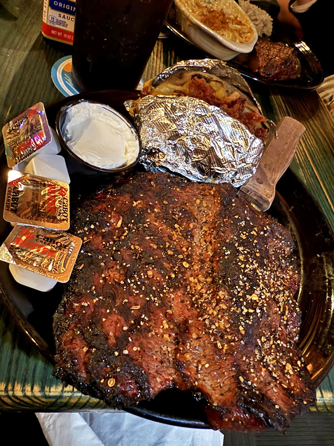 A perfectly seasoned steak arrives like a carnivore's dream come true &ndash; the kind of meal that demands a moment of reverent silence.