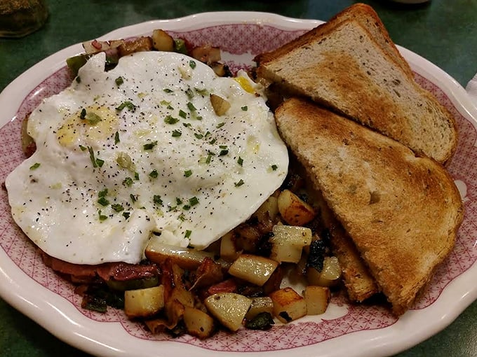 This isn't just corned beef hash &ndash; it's a mountain of breakfast bliss topped with perfectly cooked eggs that ooze golden goodness when pierced.