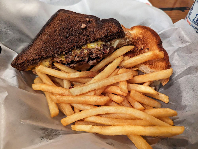 The Double Agent burger with perfectly crisp fries &ndash; a masterclass in flavor infiltration that would impress even the most seasoned operative.