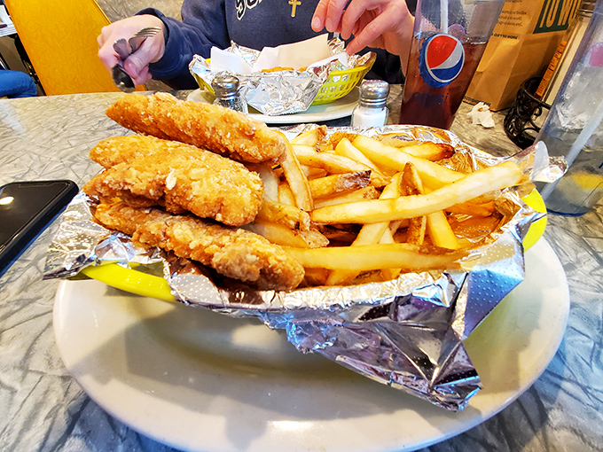 Golden-battered fish and perfectly crisp fries that would make British pubs nervous&mdash;served unpretentiously in foil for maximum heat retention.