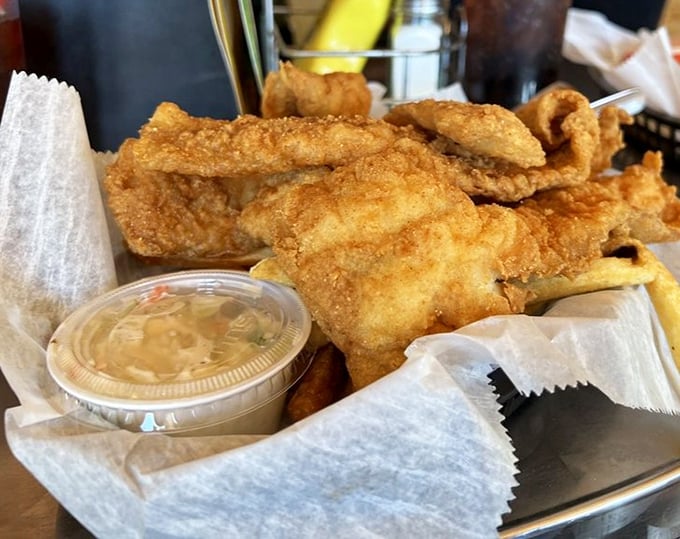 Golden-battered fish and chips that shatter with each bite, served with housemade tartar sauce that adds the perfect tangy counterpoint.