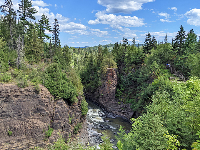 The Pigeon River carved this dramatic gorge over millennia, creating a natural boundary between two nations that's anything but boring.