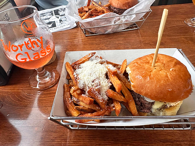 A perfectly crafted burger sits beside golden Worthy Fries dusted with parmesan &ndash; proof that heaven exists between two buns in rural Vermont.