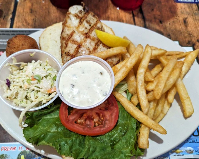 This grouper sandwich isn't just lunch &ndash; it's a Florida vacation between two buns, complete with crispy fries and creamy slaw.