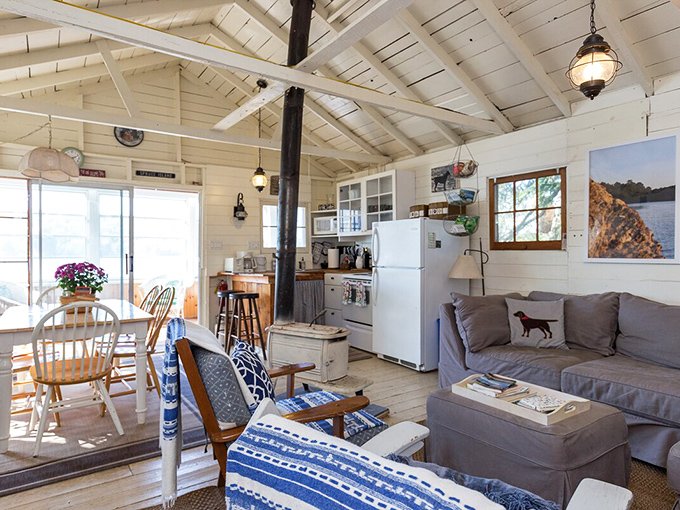 Rustic charm meets cozy comfort in this living space where every window frames nature's ever-changing artwork.