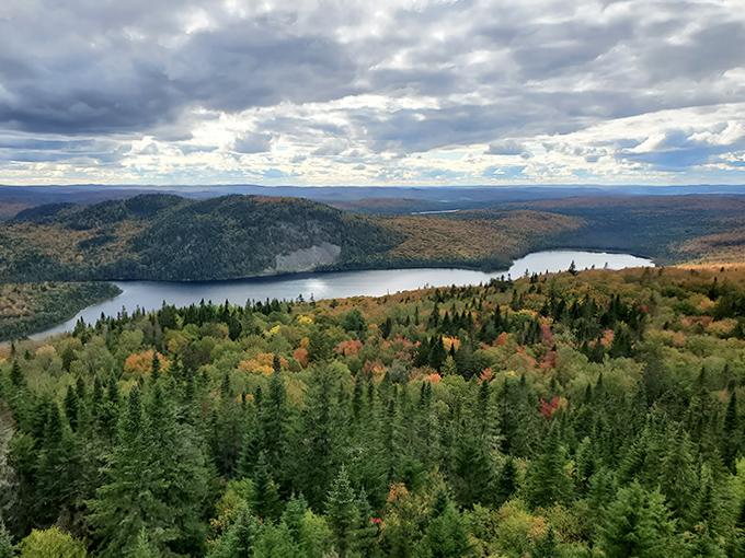 Lake views that make postcards jealous! This peak perspective showcases Maine's water-and-woodland tapestry in high definition.