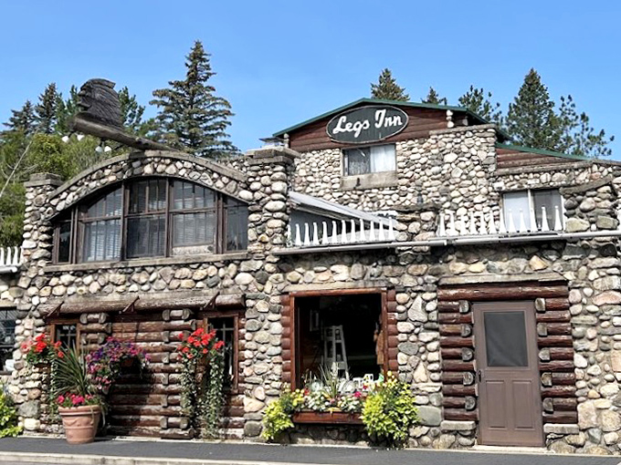 The iconic Legs Inn stands as a quirky landmark in Cross Village, where Polish cuisine meets northwoods architecture at the tunnel's northern terminus.