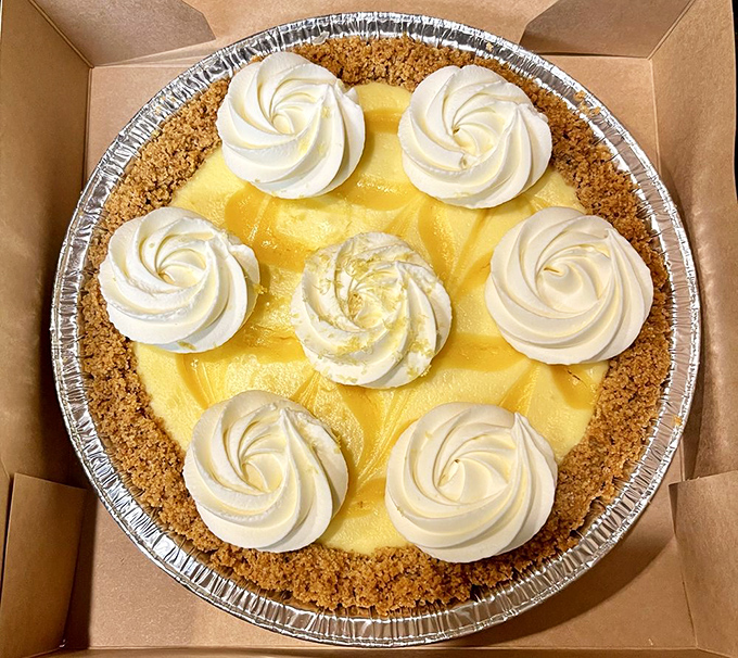 This Key Lime pie's swirls of whipped cream dance atop a sunshine-yellow filling that balances sweet and tart in perfect harmony.