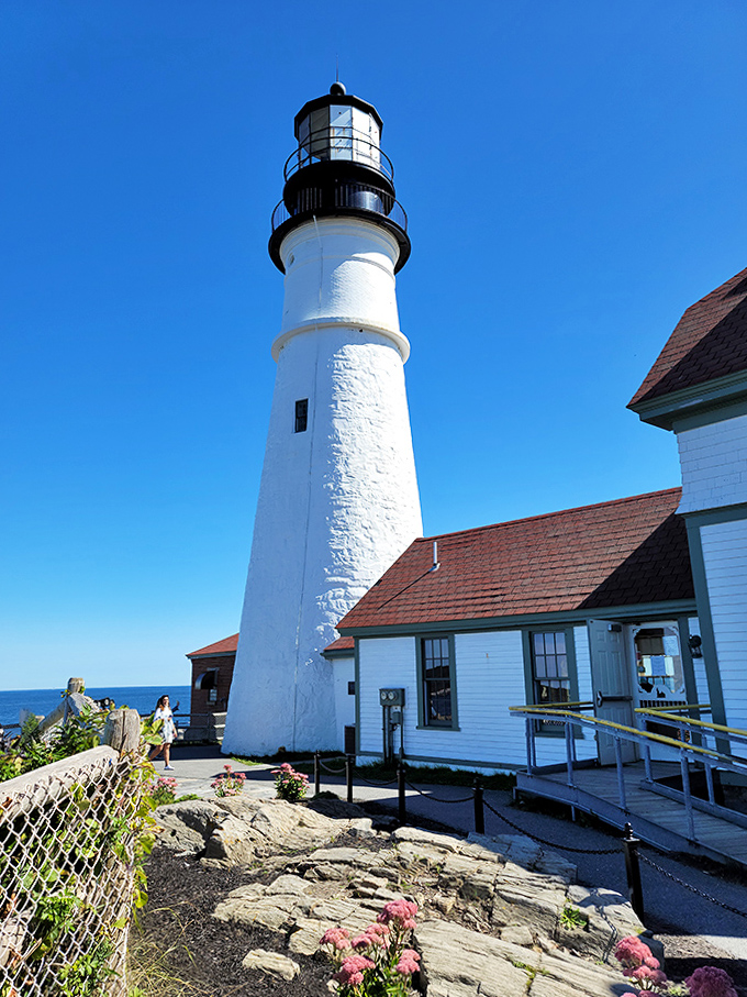 Sunshine bathes the lighthouse keeper's quarters in golden light, making even non-photographers reach for their cameras.