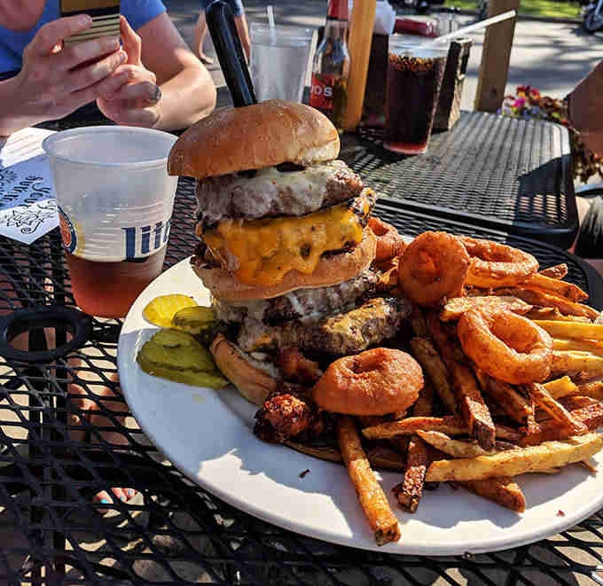 The legendary 2-pound burger arrives like a meaty skyscraper, challenging brave diners with its towering beef architecture.