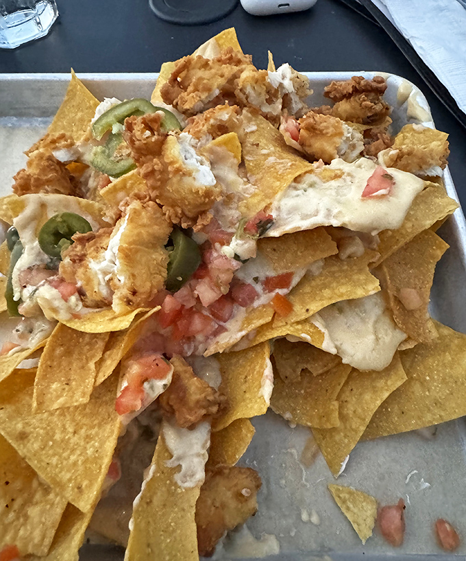 These aren't your average nachos &ndash; they're a mountain of crispy chips topped with hand-breaded chicken tenders that might make you forget about the actual mountain outside.