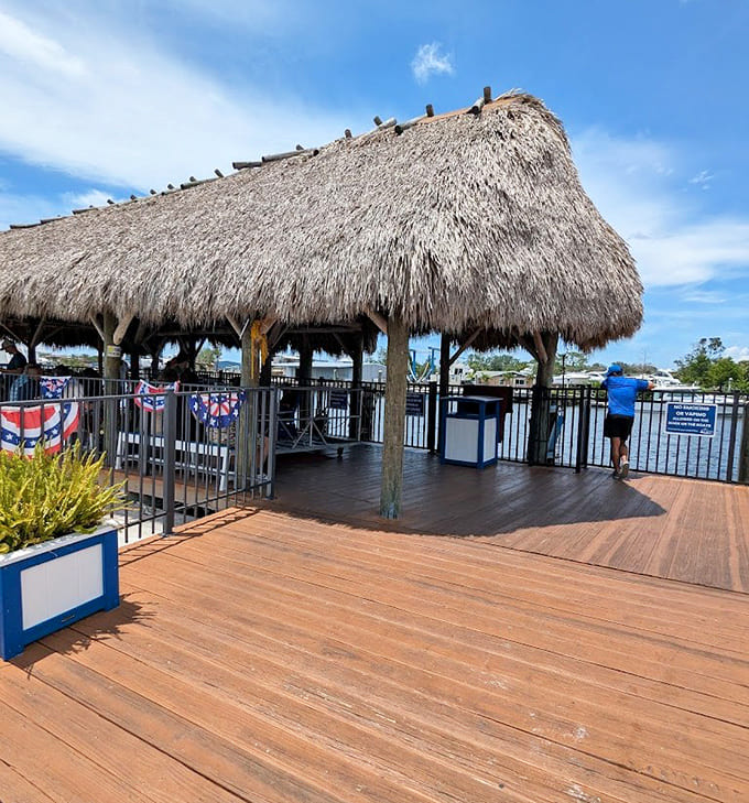 The tiki-topped pavilion provides the perfect spot to gather before departure, offering shade and waterfront views that set the mood.