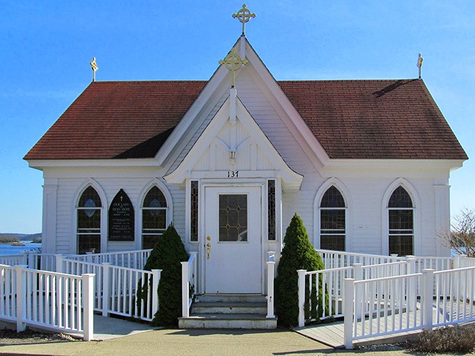 Our Lady of Holy Hope Church perches delicately on the hillside, its white simplicity a testament to Maine's understated approach to beauty.