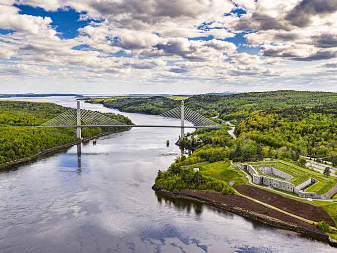 The Penobscot River winds through forests like nature's own highway, no traffic jams included.