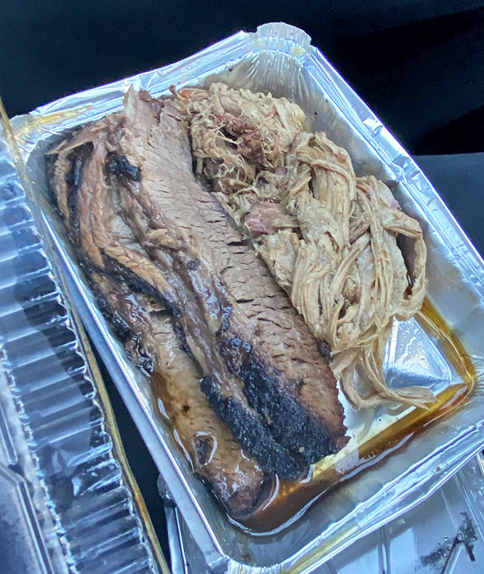 Pulled Pork and Brisket: The dynamic duo of barbecue perfection &ndash; tender strands of pork alongside slices of brisket with that coveted smoke ring.et