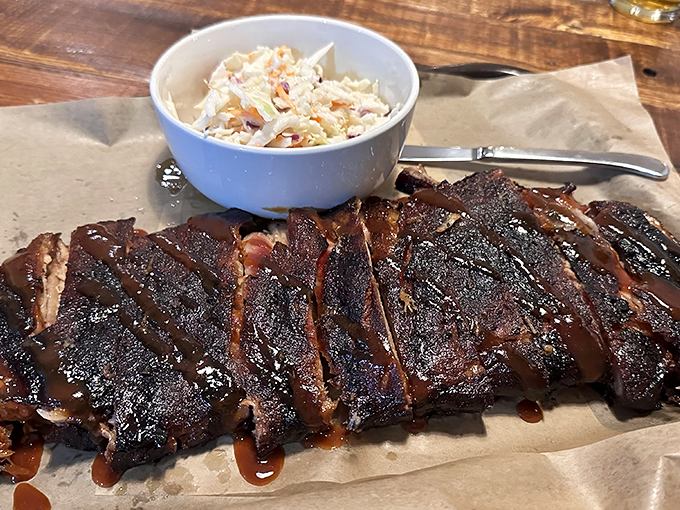 Behold the brisket! Tender, smoky perfection with that coveted pink ring and a bark that'll make you weak in the knees.