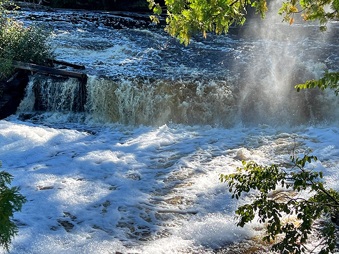The powerful current transforms from smooth glass to frothy chaos in seconds, like nature decided to uncork its finest champagne.