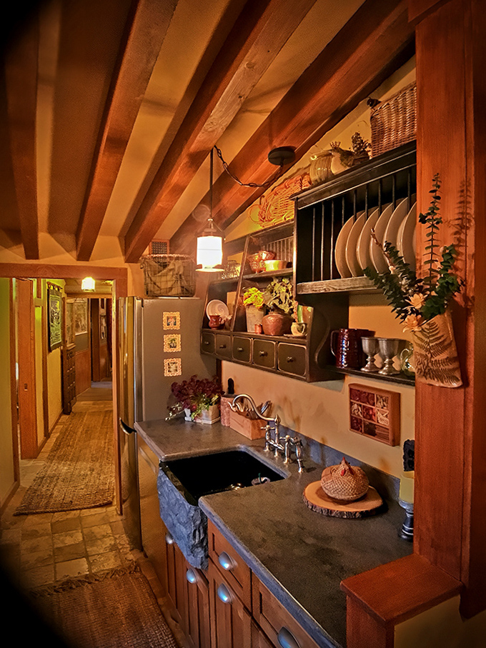 Rustic elegance defines the kitchen area, where wooden beams and stone elements create a space worthy of hobbit hospitality.