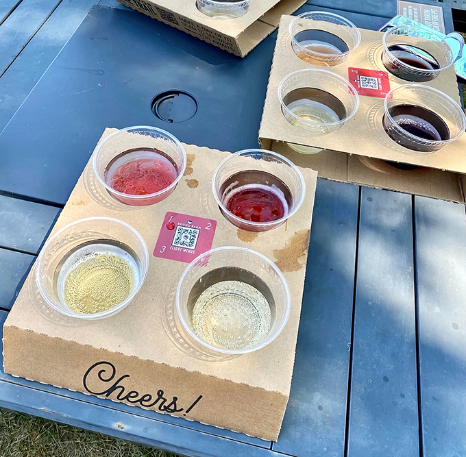 Tasting flight delight: Colorful sangrias and sweet wines await sampling in this wooden flight holder, each tiny glass a portal to flavor country.