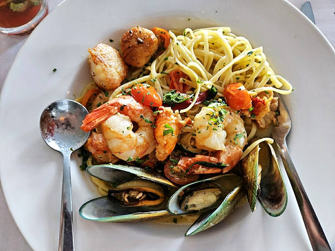 Seafood linguine that makes you want to twirl your fork in slow motion – plump shrimp and mussels nestled in perfectly al dente pasta.