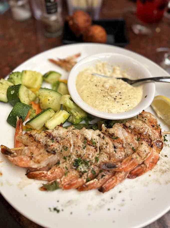 Perfectly grilled shrimp over a bed of goodness that makes you wonder why anyone orders anything else, until you see the rest of the menu.