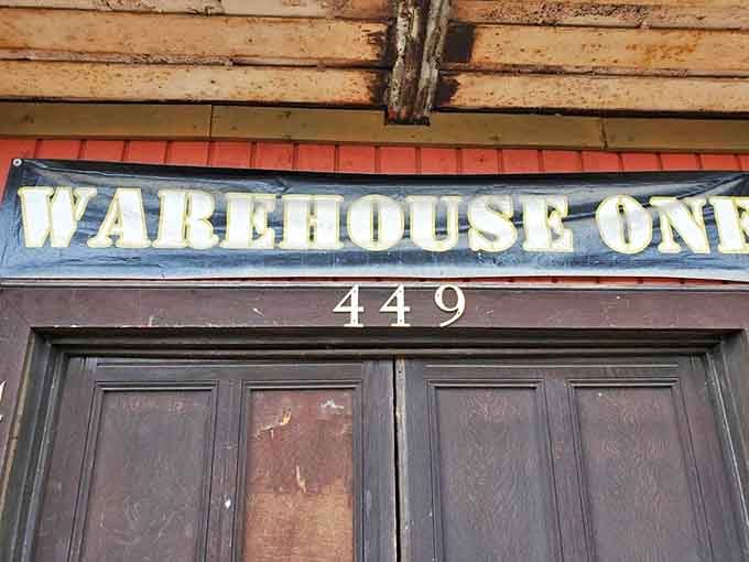 The iconic Warehouse One signage, weathered by Michigan seasons, has become a beacon for antique enthusiasts throughout the Midwest.