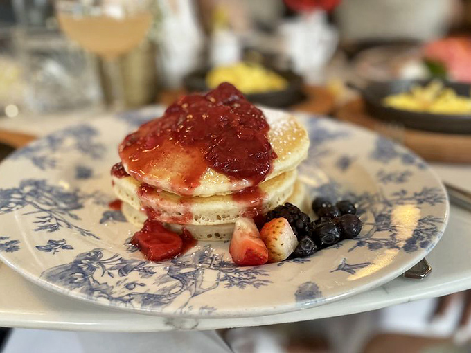 Pancakes wearing their Sunday best! These berry-topped beauties aren't just breakfast; they're an edible still life that happens to taste like heaven.