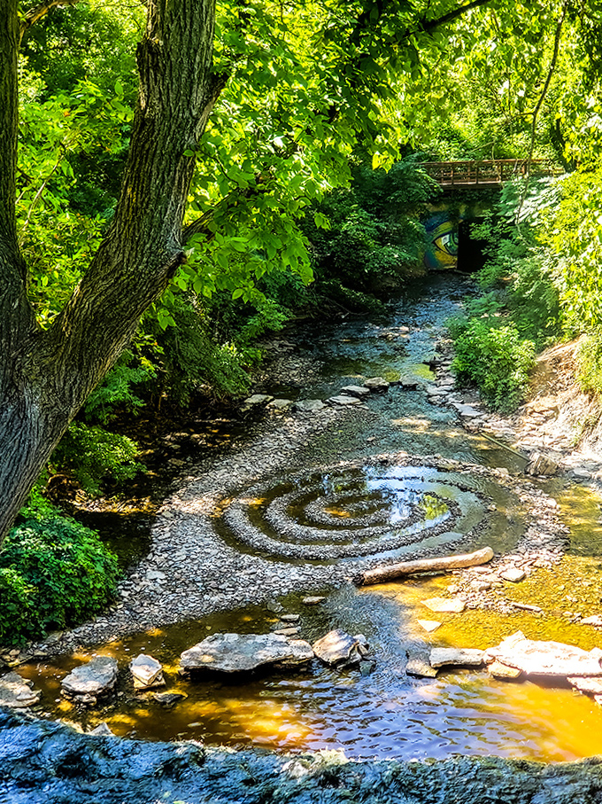 Someone's been playing with nature's building blocks! This mesmerizing stone spiral adds human artistry to the creek's natural beauty.