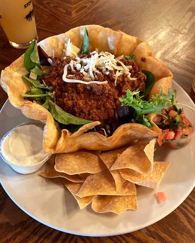 A taco salad that breaks all the rules &ndash; crispy shell, seasoned meat, fresh greens, and just enough cheese to make you forget you ordered a "salad."