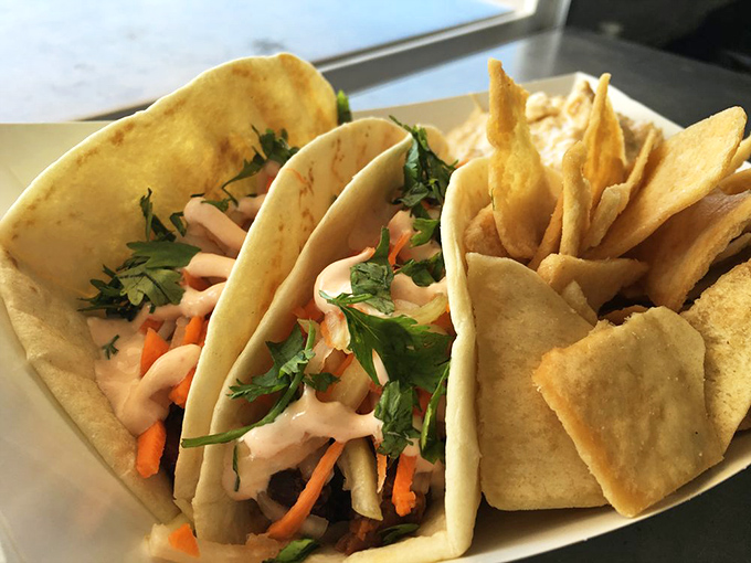 These aren't your average tacos! The Trippy Tacos combine teriyaki chicken, Asian slaw, and cilantro with a drizzle of Sriracha crema for a mind-expanding flavor journey.