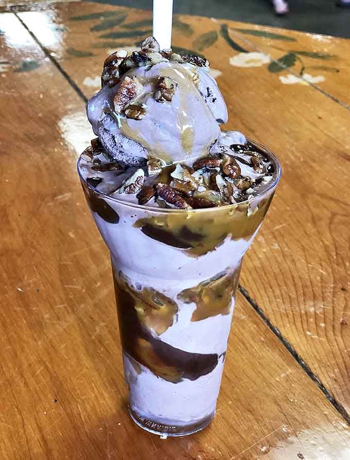 The Turtle Sundae towers like a delicious skyscraper, proving that sometimes more really is more when it comes to dessert.