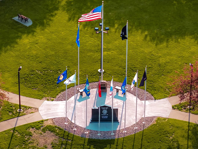 Harmony's Veterans Memorial stands proud with flags snapping in the breeze, a solemn reminder of service and sacrifice in this peaceful corner of Minnesota.