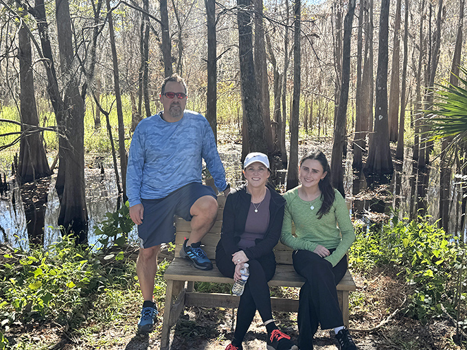 Visitors take a moment to rest and soak in the natural splendor, finding connection with Florida's wild heart away from tourist crowds.