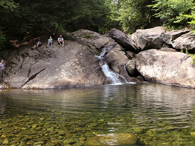 Summer's perfect playground: locals know the best spots for jumping, where ancient rocks create natural diving platforms above refreshing depths.
