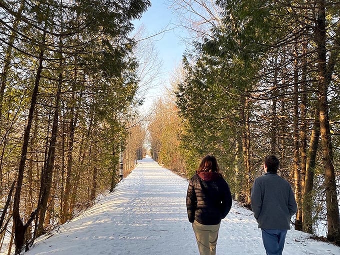 Winter transforms the Island Line Trail into a snow-covered wonderland – just bring extra layers for that lake wind!