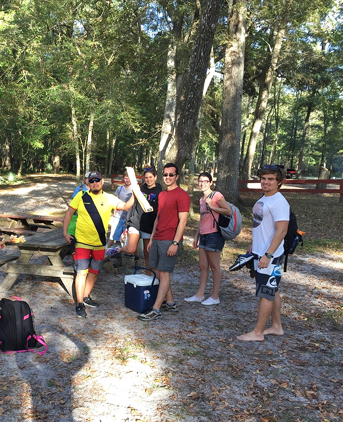 Friends gathering for a day of adventure &ndash; nothing says "Florida fun" like coolers, floats, and the promise of crystal-clear springs ahead!