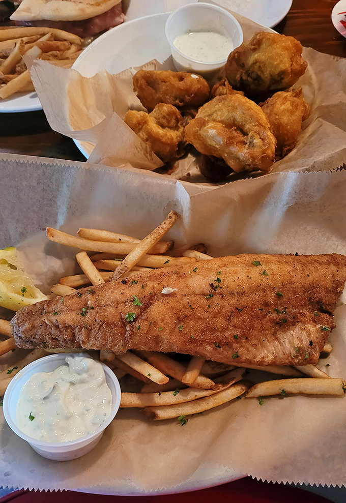 This isn't just fish – it's a golden-crusted walleye that flakes at the touch of a fork, served with hand-cut fries that put fast food to shame.