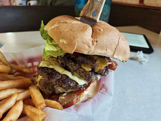Behold the one-pound burger, a magnificent beast that laughs at your diet plans and wins every time.