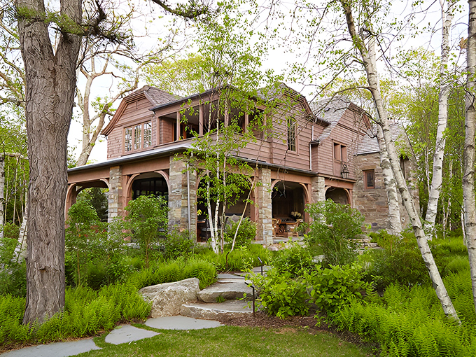 Birch trees frame this extraordinary retreat, where Maine coastal architecture meets African safari lodge in perfect harmony.