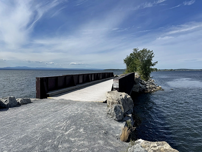 The causeway's wooden bridge section offers a moment of transition &ndash; from land to what feels like walking on water itself.