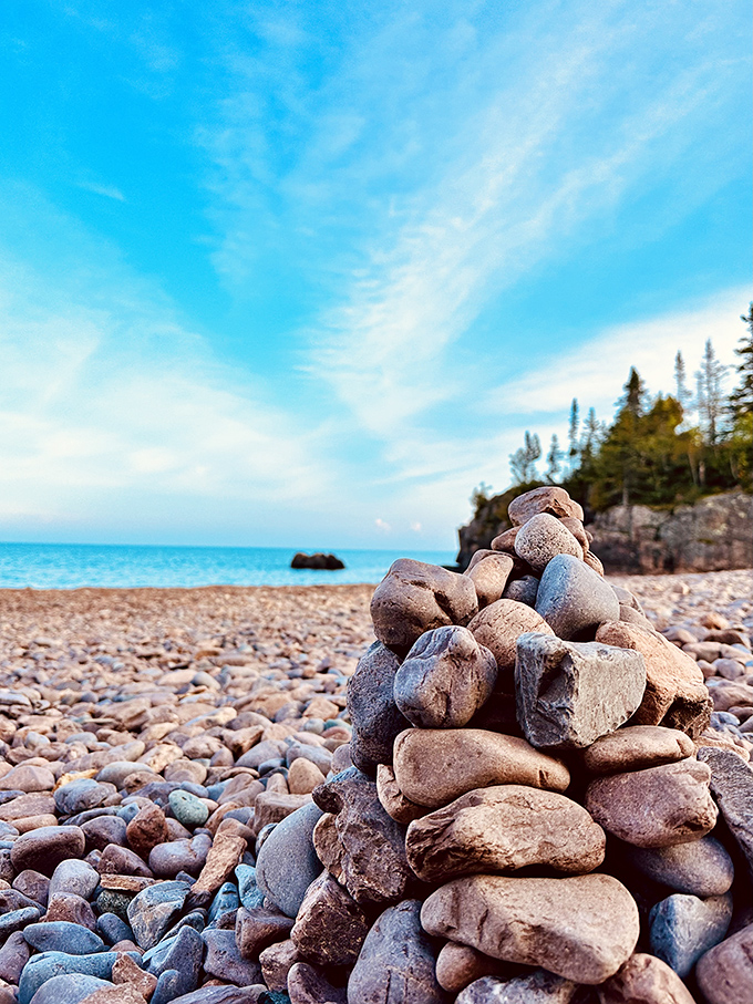 Visitors build cairns along the shoreline, adding their own temporary art to this already stunning natural gallery.
