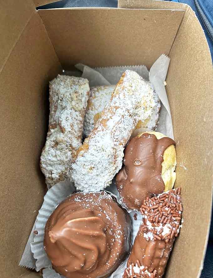 Heaven in a box &ndash; powdered cannoli alongside chocolate-dipped delights. Diet plans have been known to spontaneously combust within a ten-foot radius.