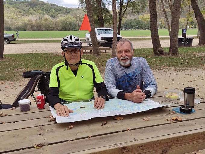 Trail enthusiasts pause to consult their map, planning their journey through Minnesota's most picturesque valley.
