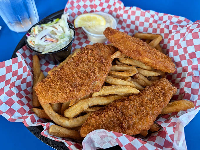 Golden-battered fish with a perfect crunch, served with crispy fries and homemade coleslaw &ndash; lake-to-plate perfection.