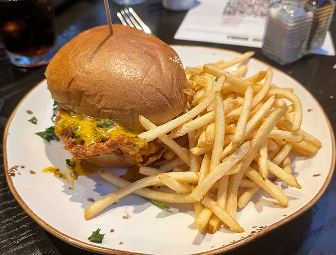 Juicy burger and fries: This isn't your sad highway hamburger – it's a hand-crafted flavor bomb that makes you forget you're dining where others pump gas.