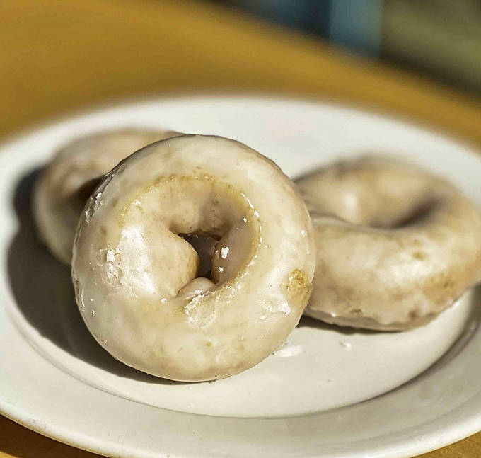 These aren't just glazed donuts &ndash; they're edible halos that somehow make Monday mornings bearable and Fridays even better.