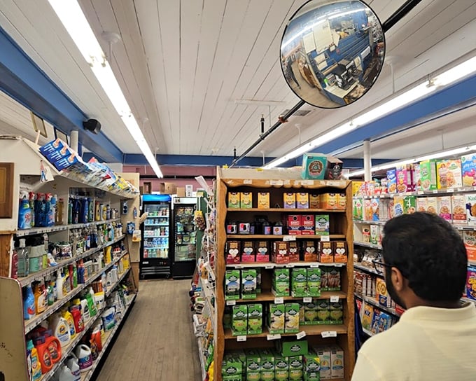 The interior reveals a retail wonderland where wooden floors creak beneath your feet, telling stories of generations of shoppers.