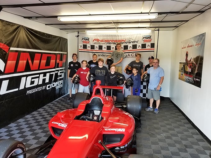 Racing dreams: Nothing says "I'm serious about this hobby" like posing with an actual Indy Lights car between go-kart sessions.